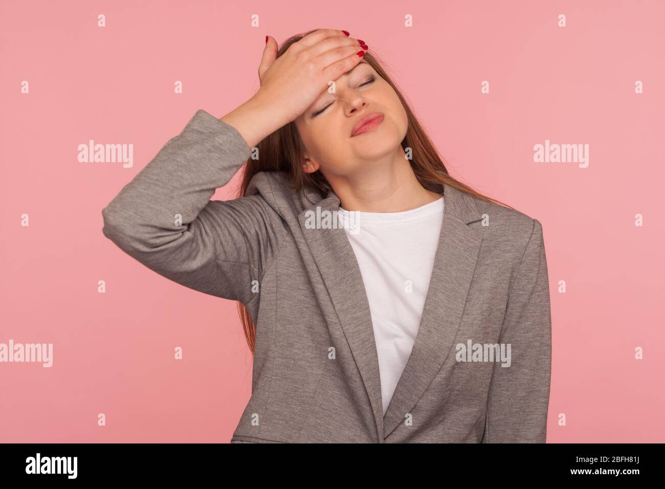 Facepalm. Portrait of forgetful upset young woman in business suit ...