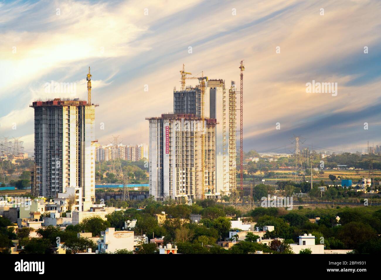 Aerial shot of under construction building with multiple floors and ...