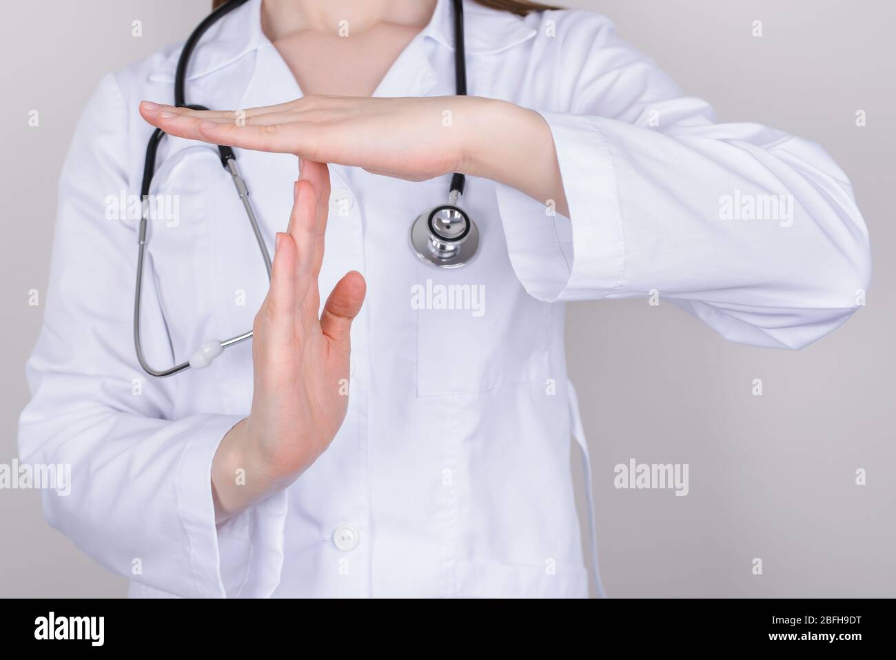 Stop panic concept. Cropped close up photo of nurse making showing ...