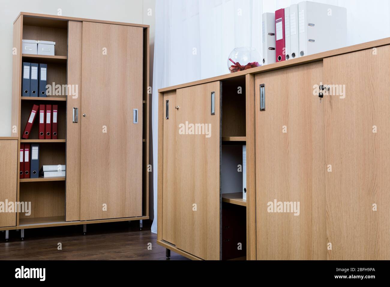 cabinets with folders in a modern office Stock Photo - Alamy