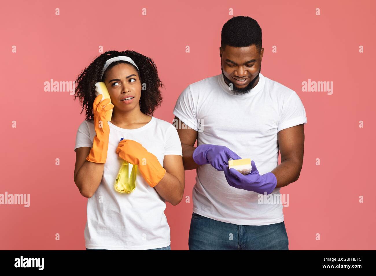 Crazy Cleaning. Funny black couple fooling together while tidying home ...