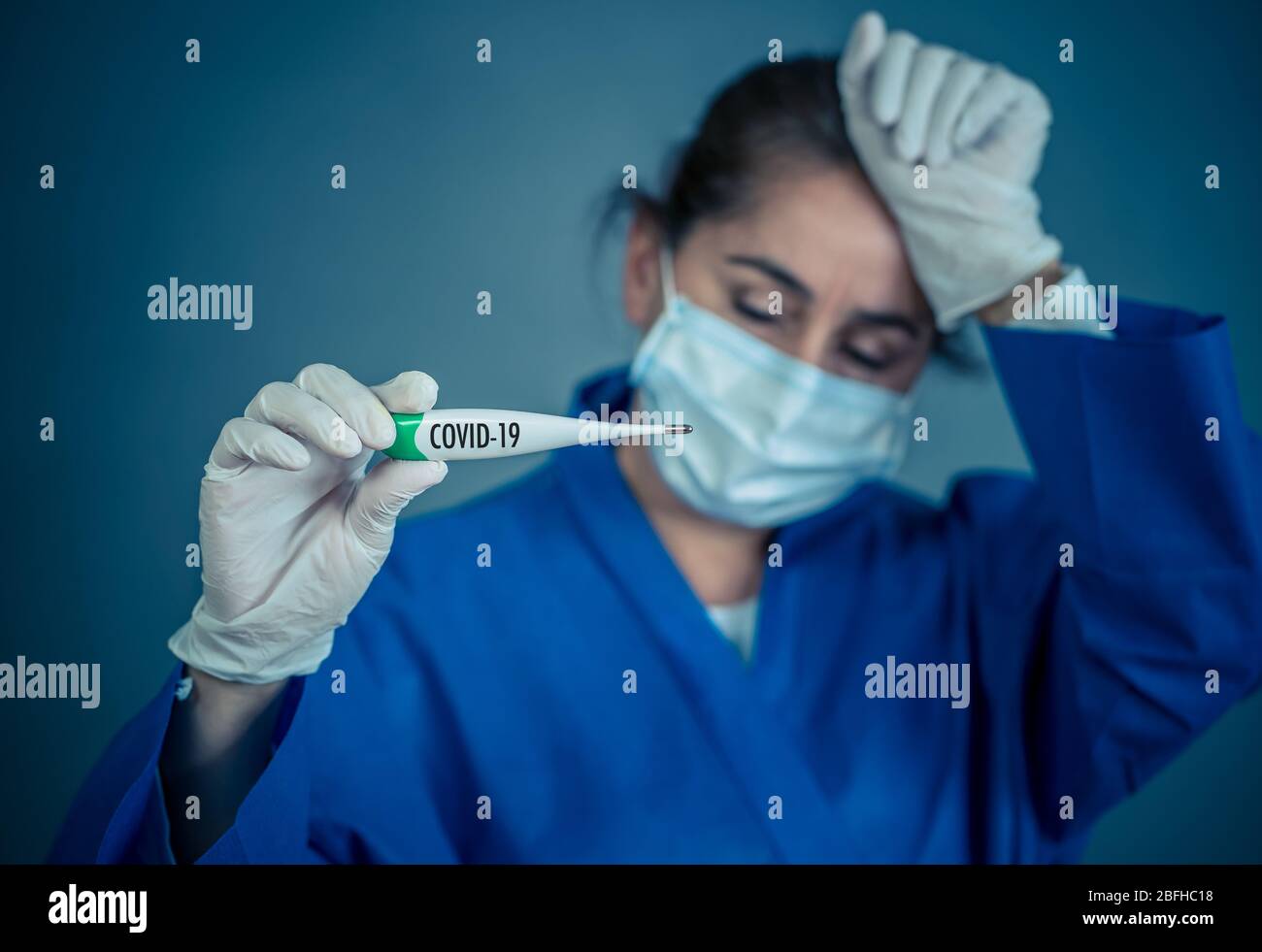 Doctor checking temperature hi-res stock photography and images - Alamy