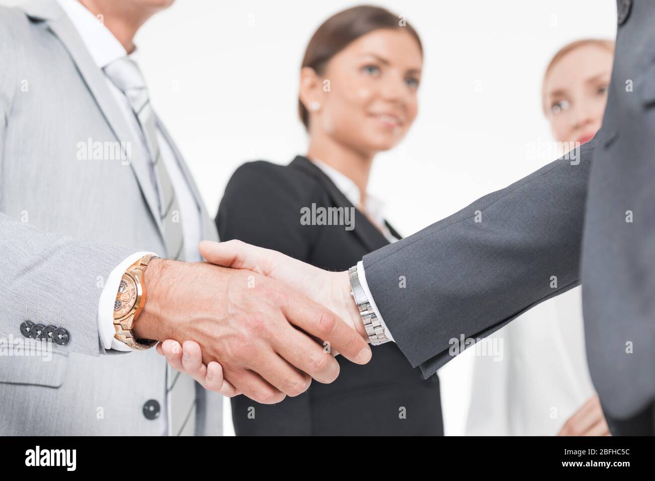 Agreement smile men handshake hi-res stock photography and images - Alamy