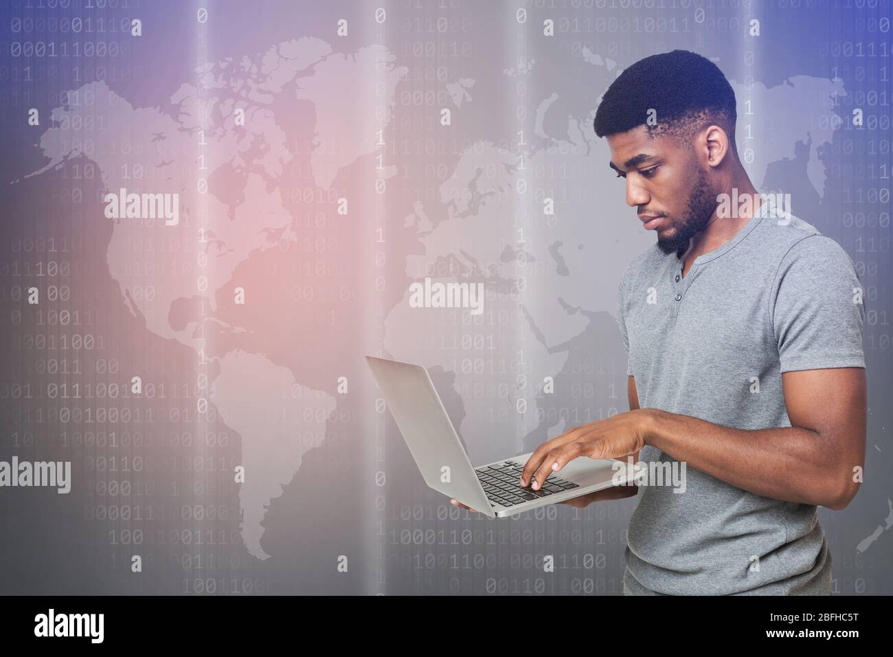 Hacker holding laptop with virtual display server data Stock Photo - Alamy