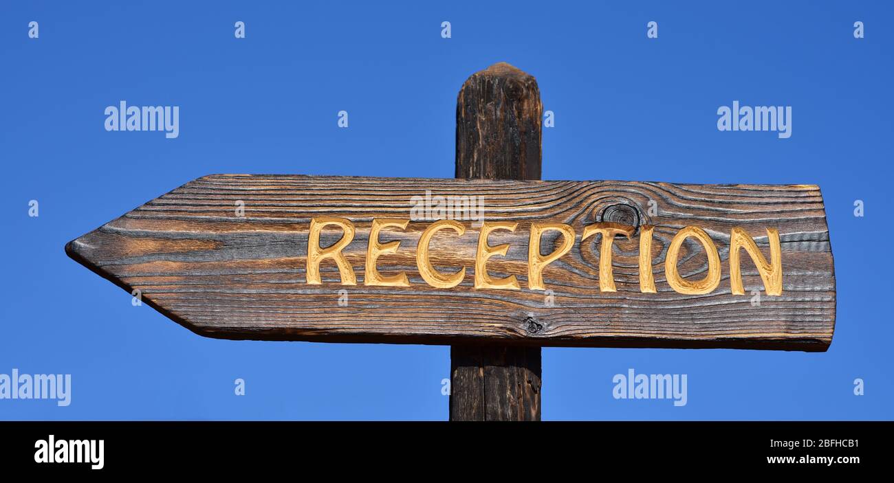 Reception inscription on a wooden sign on the hotel premises Stock ...