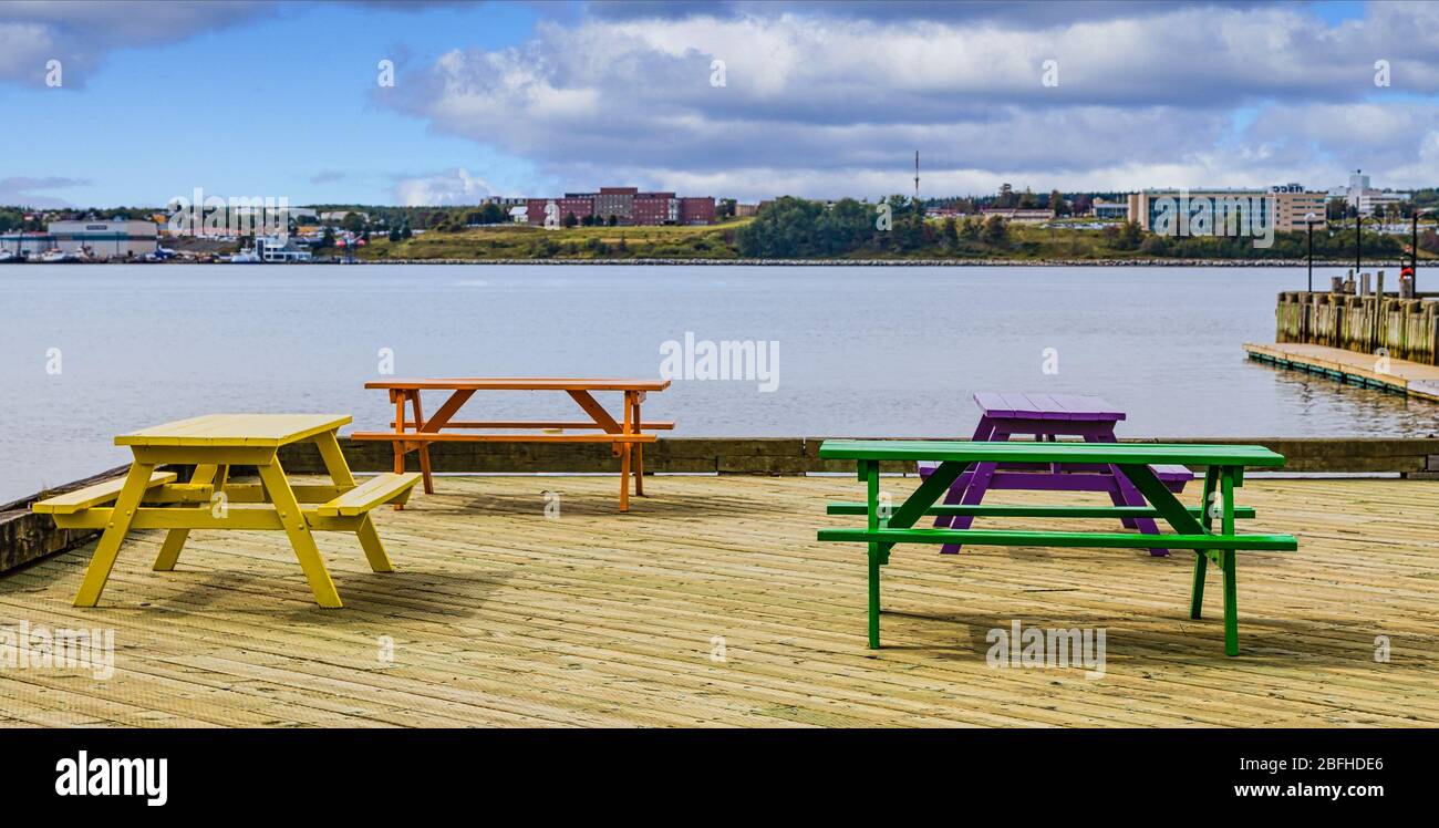 Colorful Picnic Benches on Dock Stock Photo - Alamy