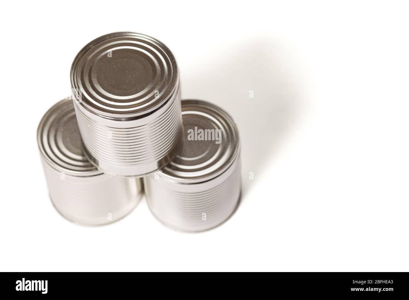 Three metal cans with preservation isolated on a white background, view ...