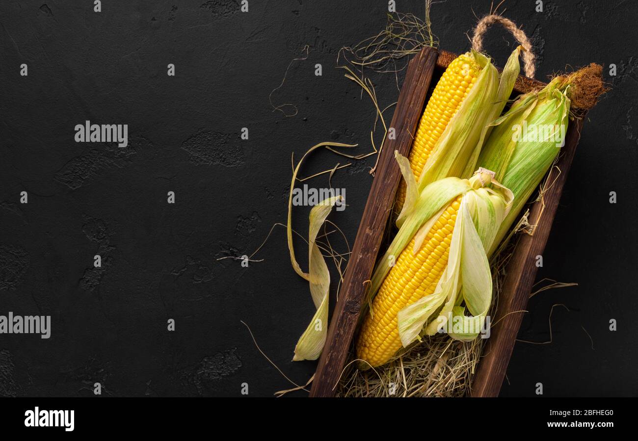 Fresh corn cobs on black background, copy space for chalk text Stock ...