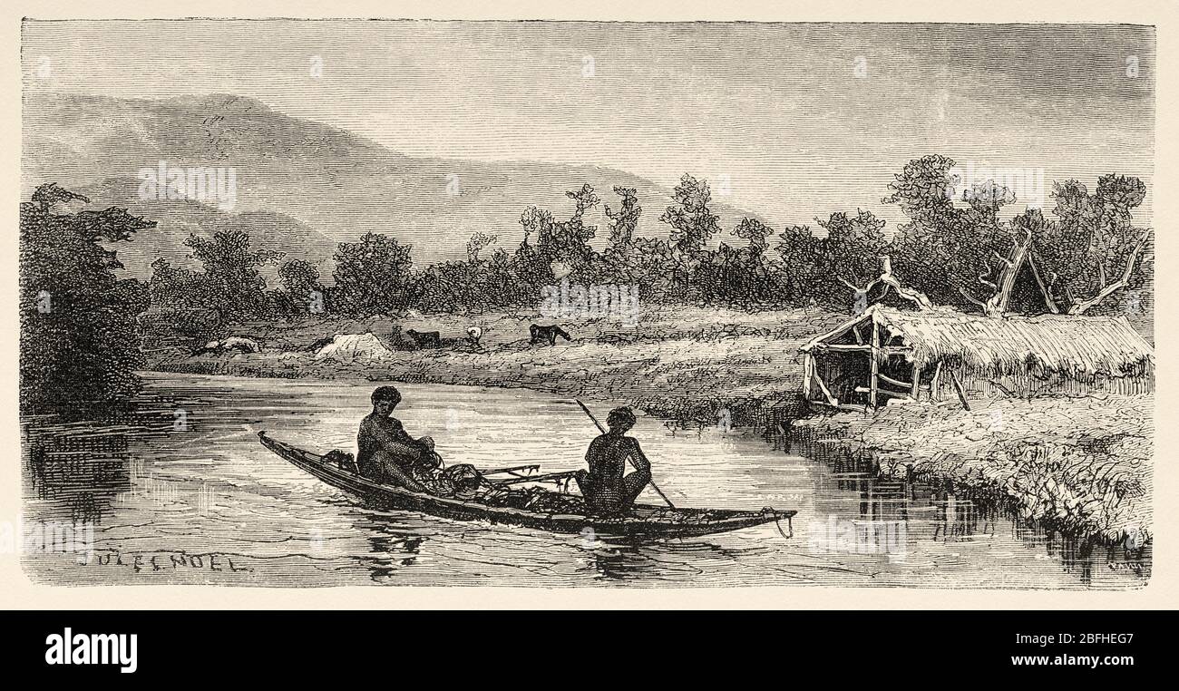 Indigenous kanaks of the Chasseloup bay by canoe, New Caledonia. Old ...
