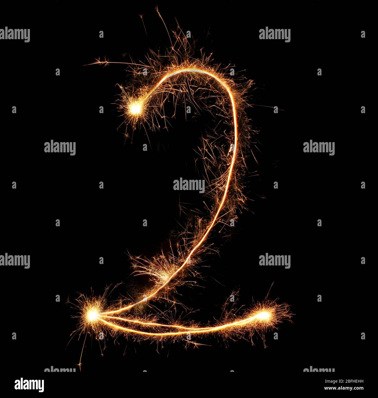 Number "two" sparklers on black background Stock Photo - Alamy