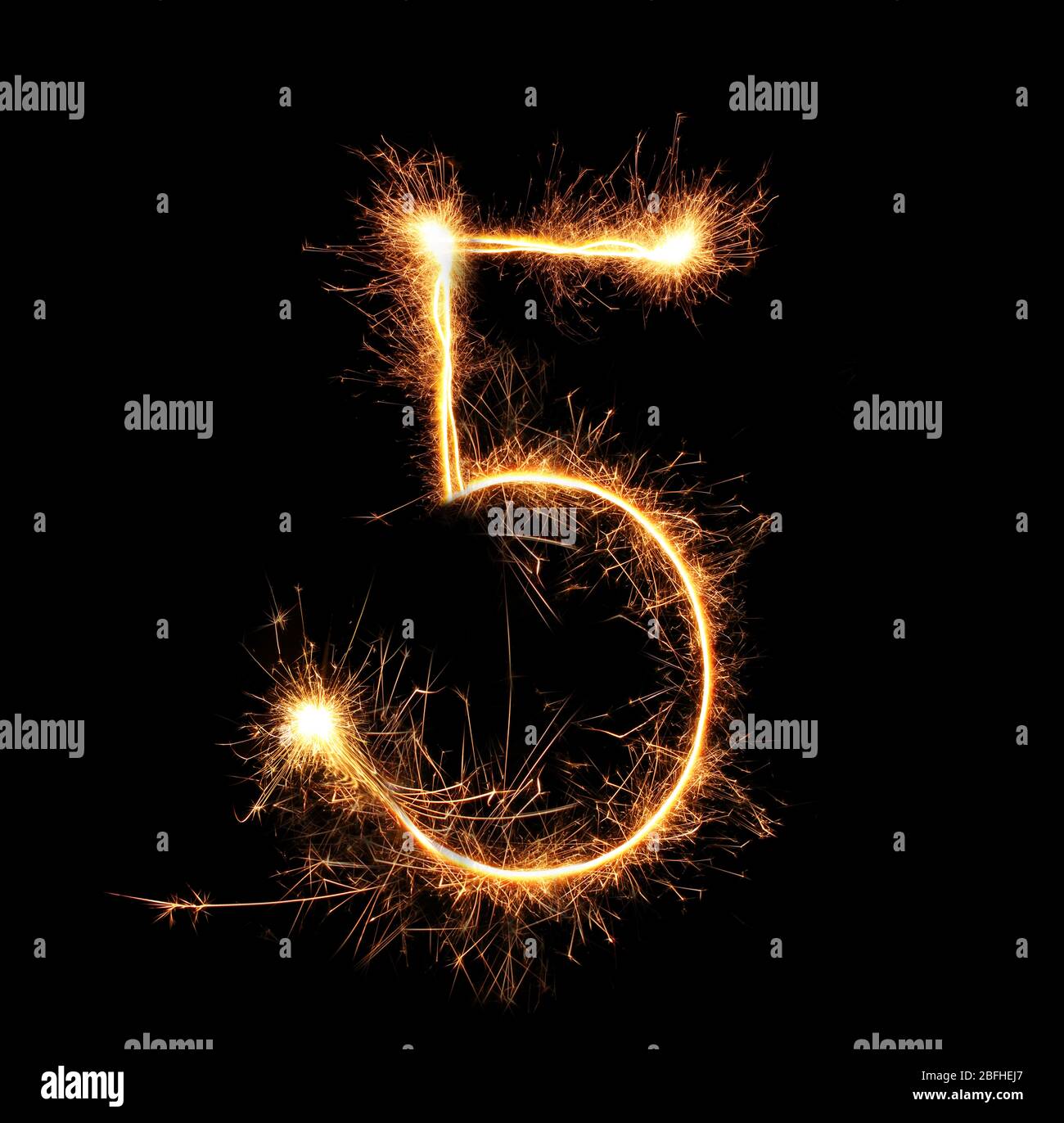Number "five" sparklers on black background Stock Photo - Alamy