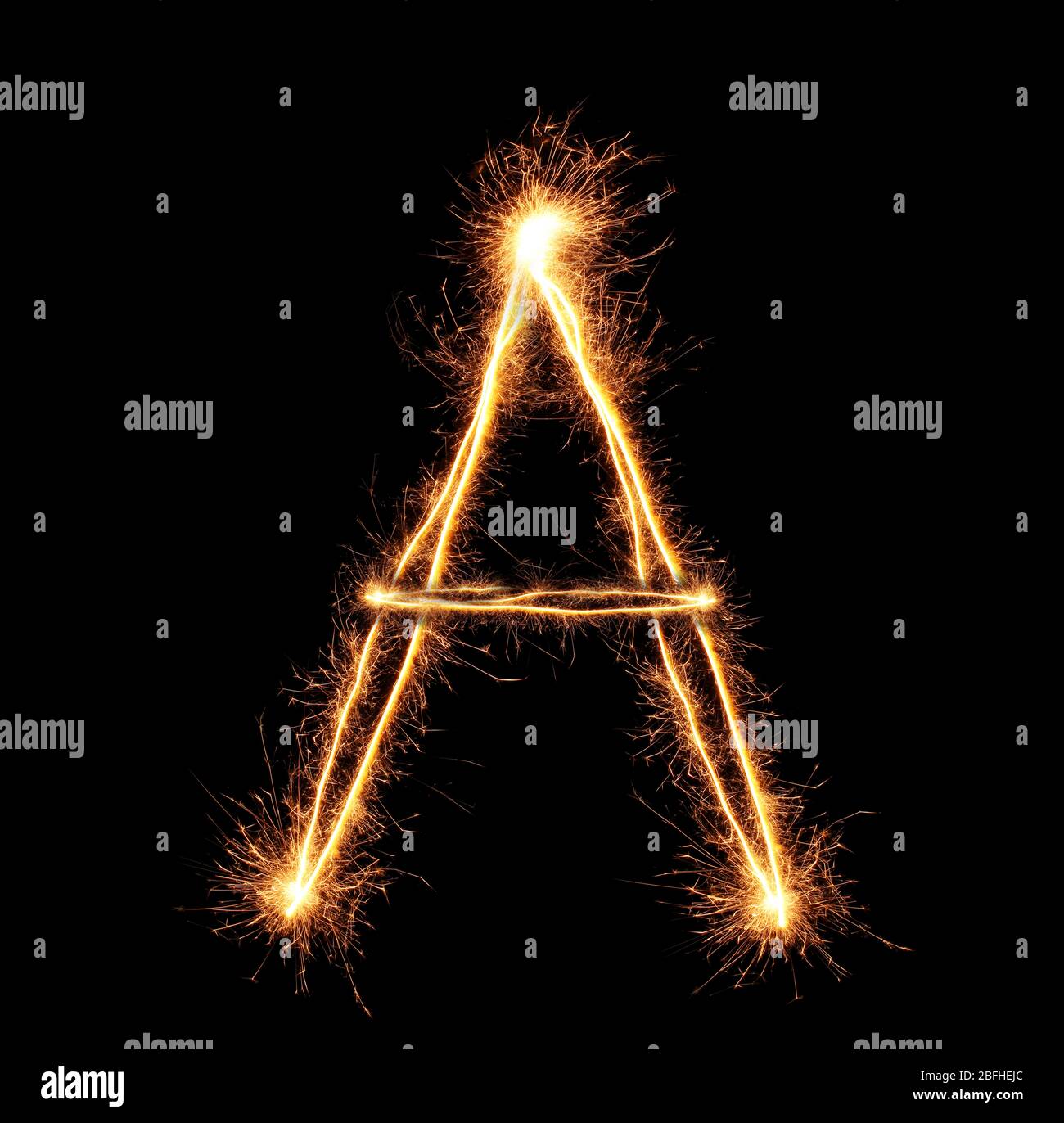 Letter "A" sparklers on black background Stock Photo - Alamy