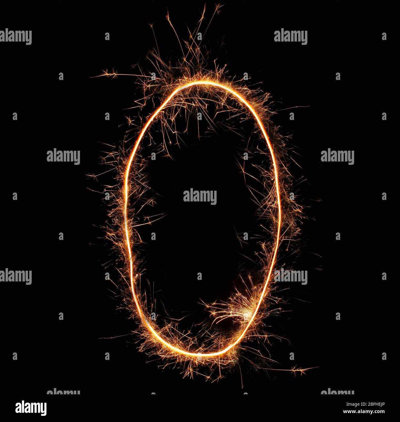 Number "zero" sparklers on black background Stock Photo - Alamy