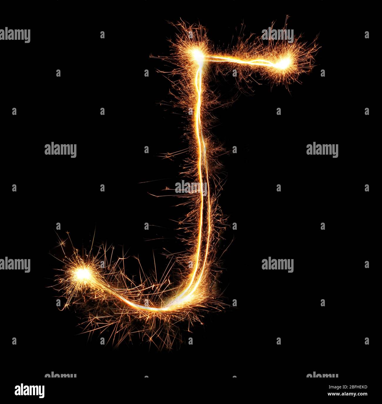 Letter "J" sparklers on black background Stock Photo - Alamy
