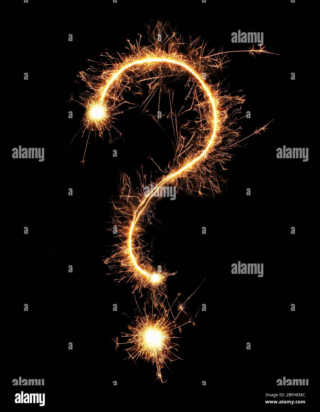 Question mark sparklers on black background Stock Photo - Alamy