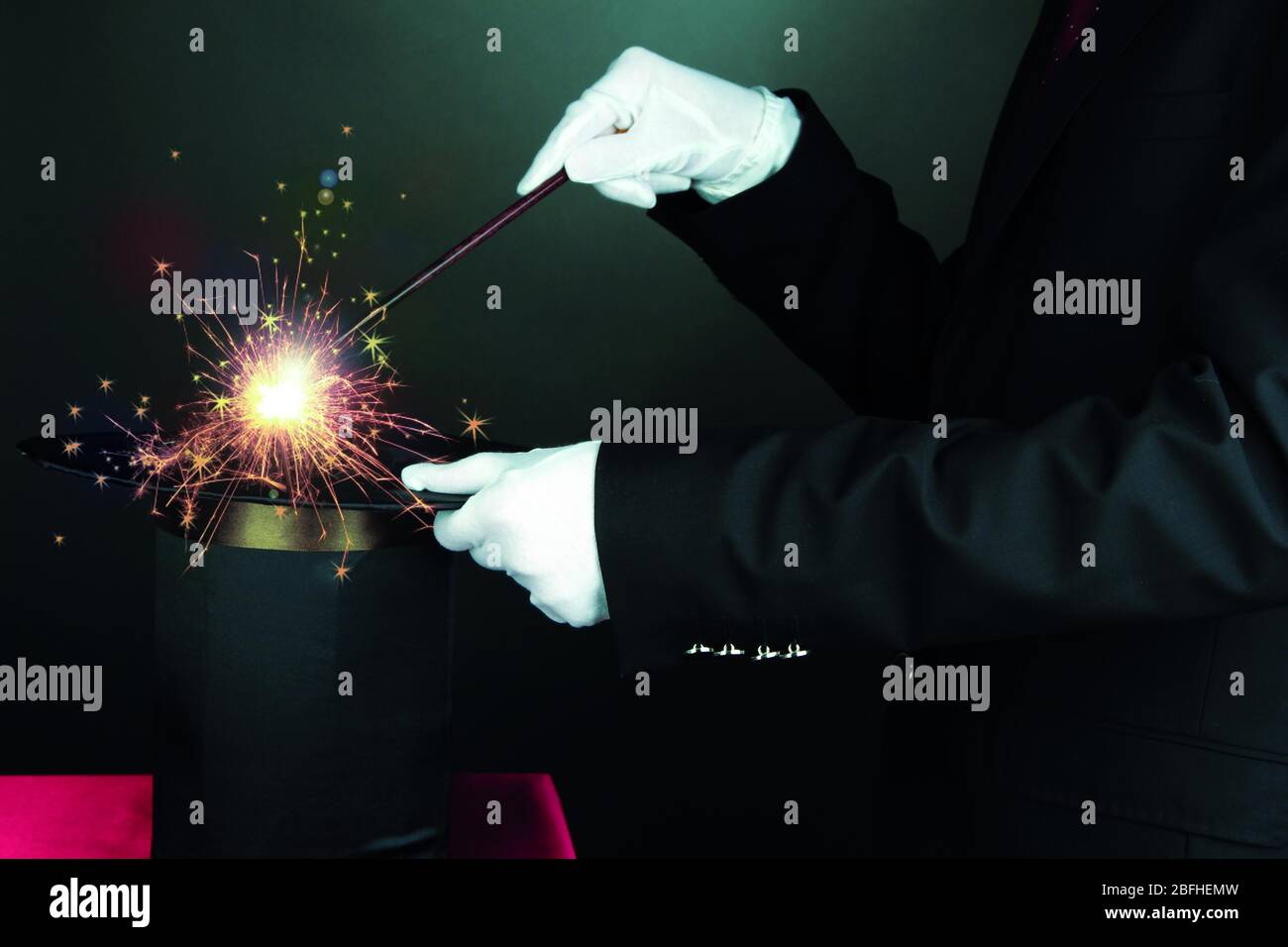 magician performance on dark background Stock Photo - Alamy