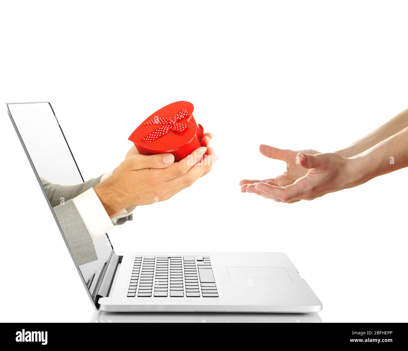 Male hand giving gift box to woman from laptop screen isolated on white ...
