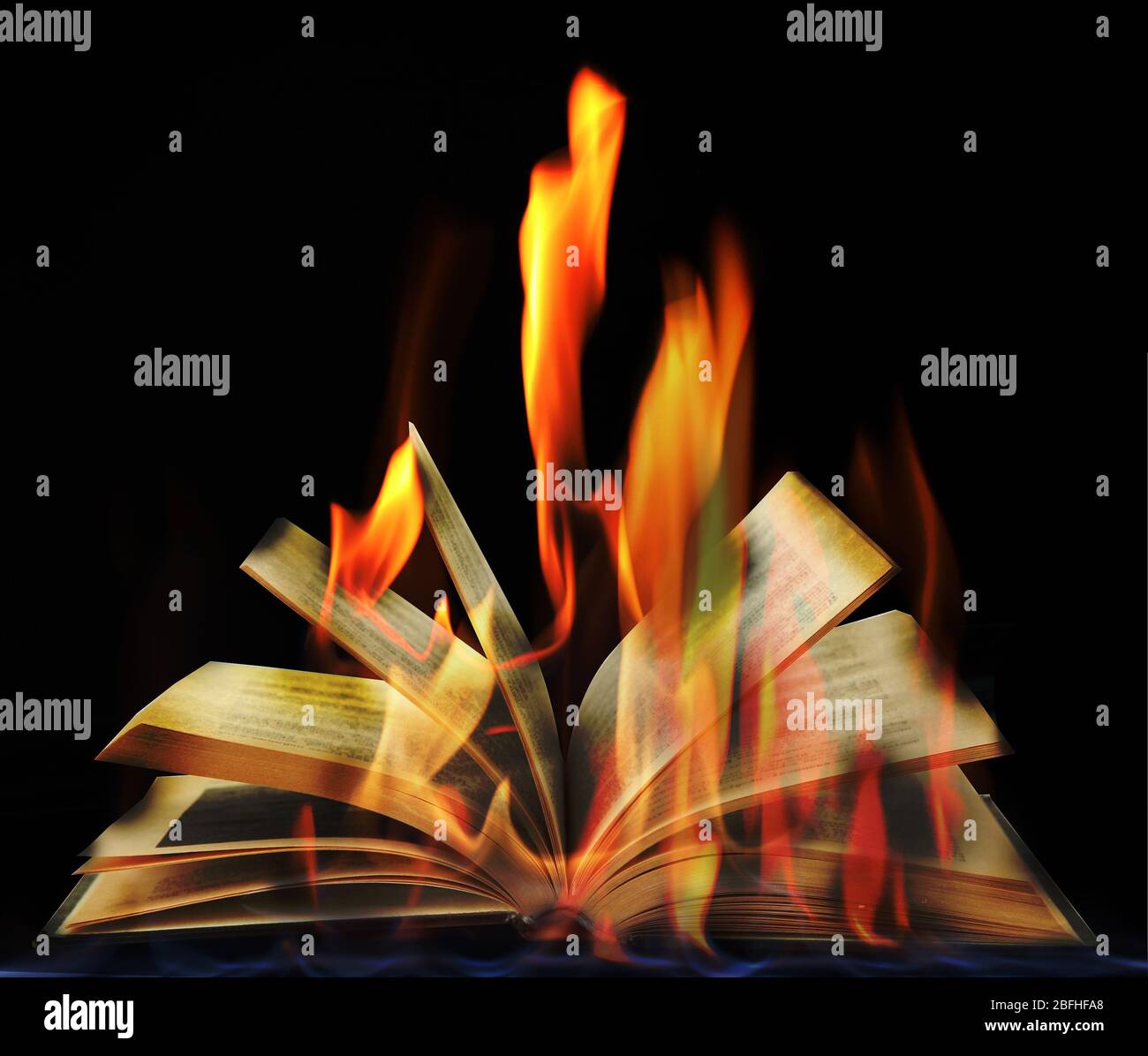 Open book in flame on black background Stock Photo - Alamy