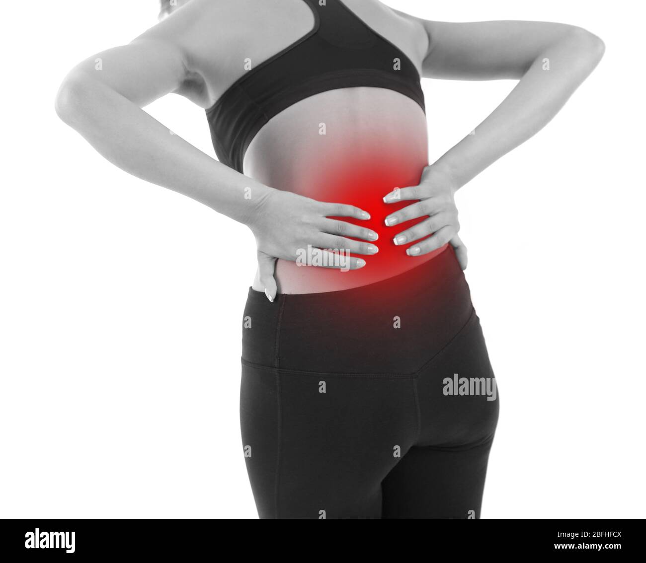 Lower back pain in woman isolated on white Stock Photo - Alamy