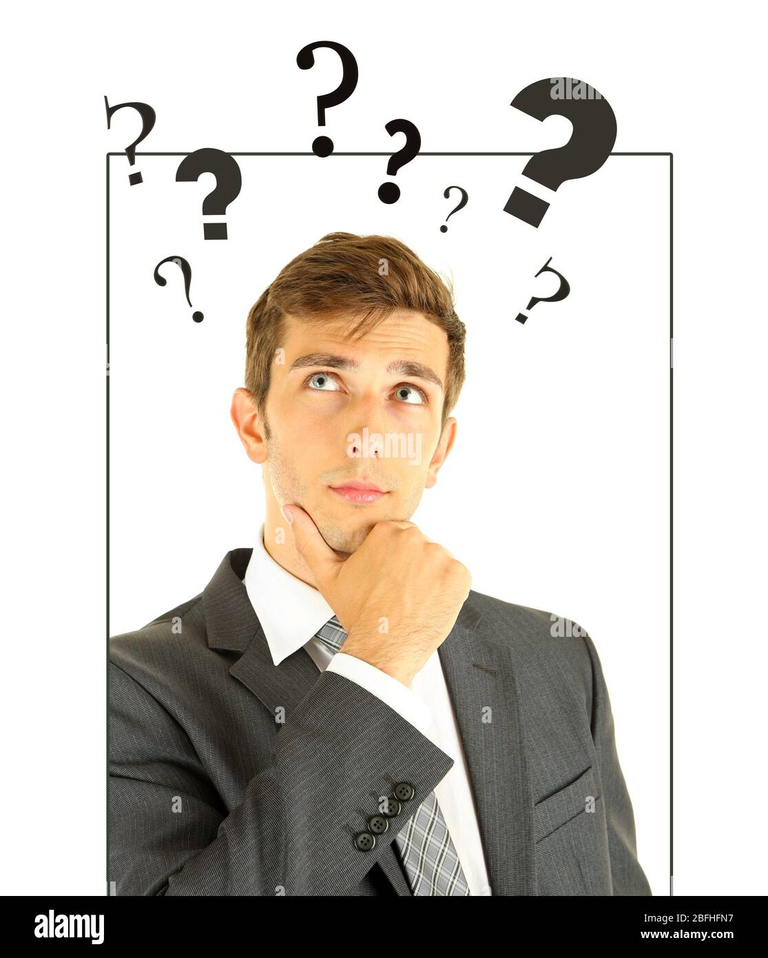 Young man thinking surrounded by question marks isolated on white Stock ...