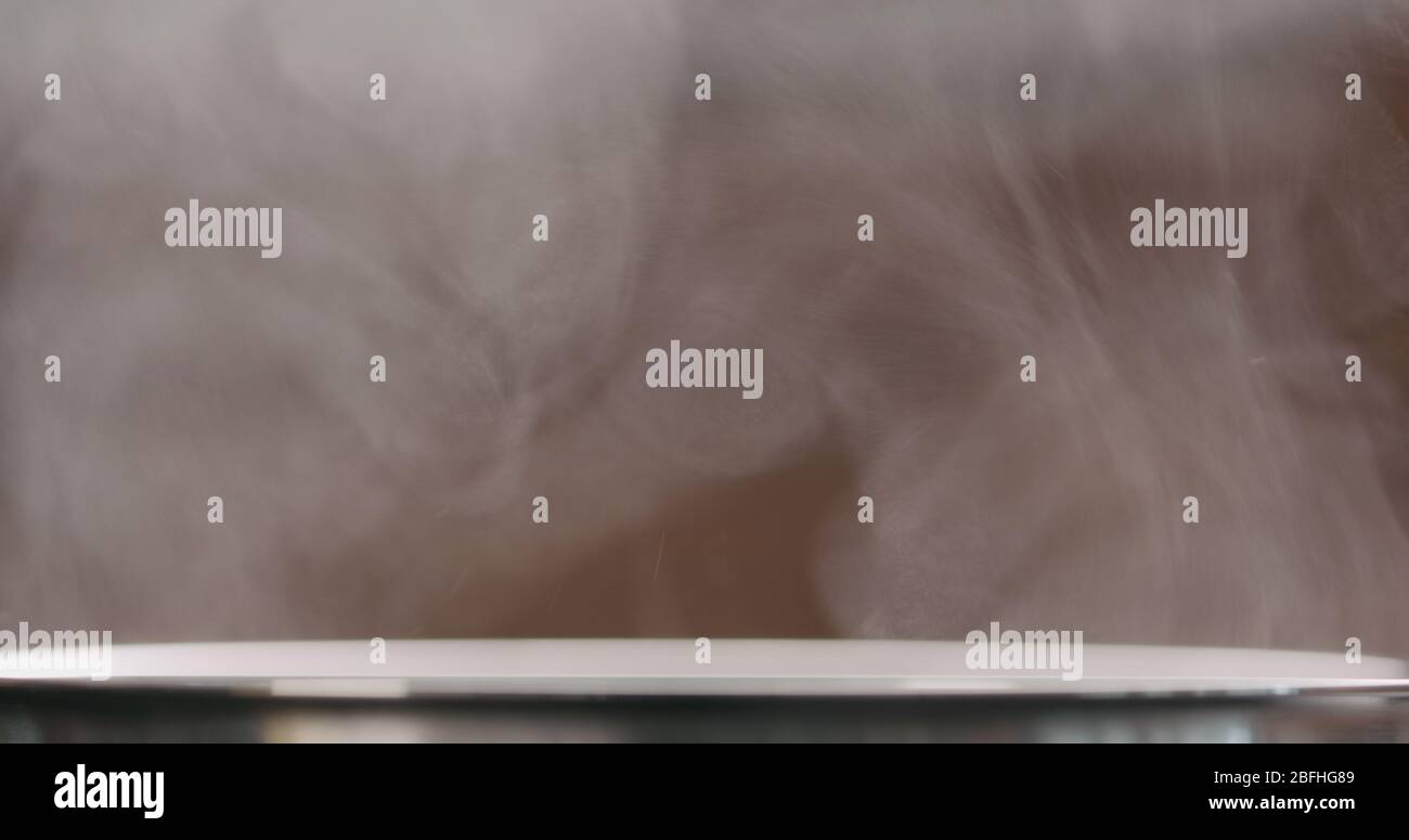steam rising from pot while cooking closeup Stock Photo - Alamy