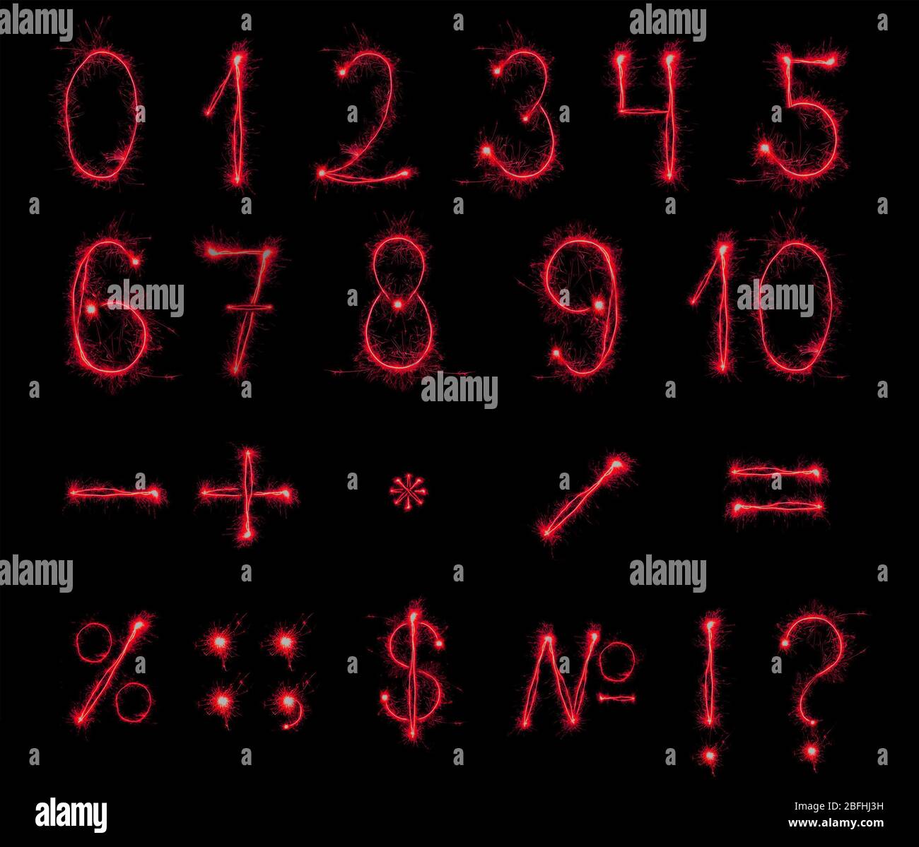 Fireworks numbers and symbols on black background Stock Photo - Alamy