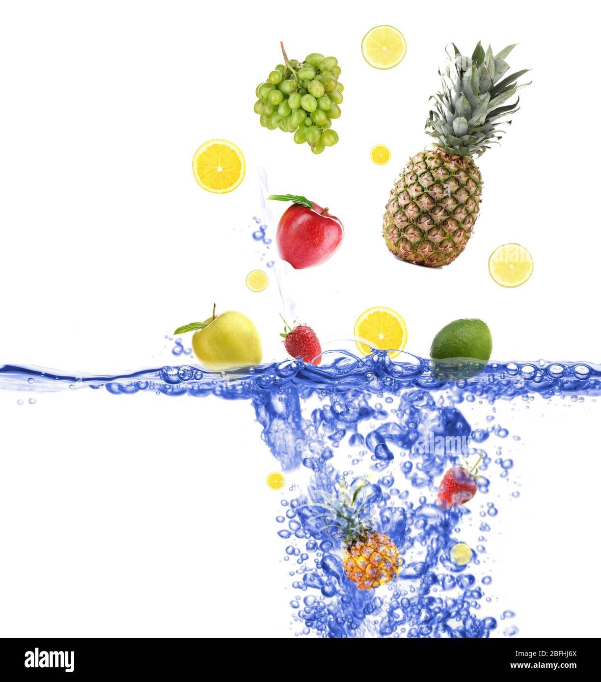 Fresh fruits dropped into water Stock Photo - Alamy