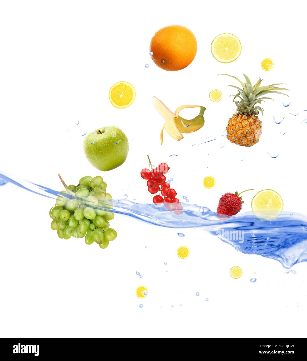 Fresh fruits dropped into water Stock Photo - Alamy