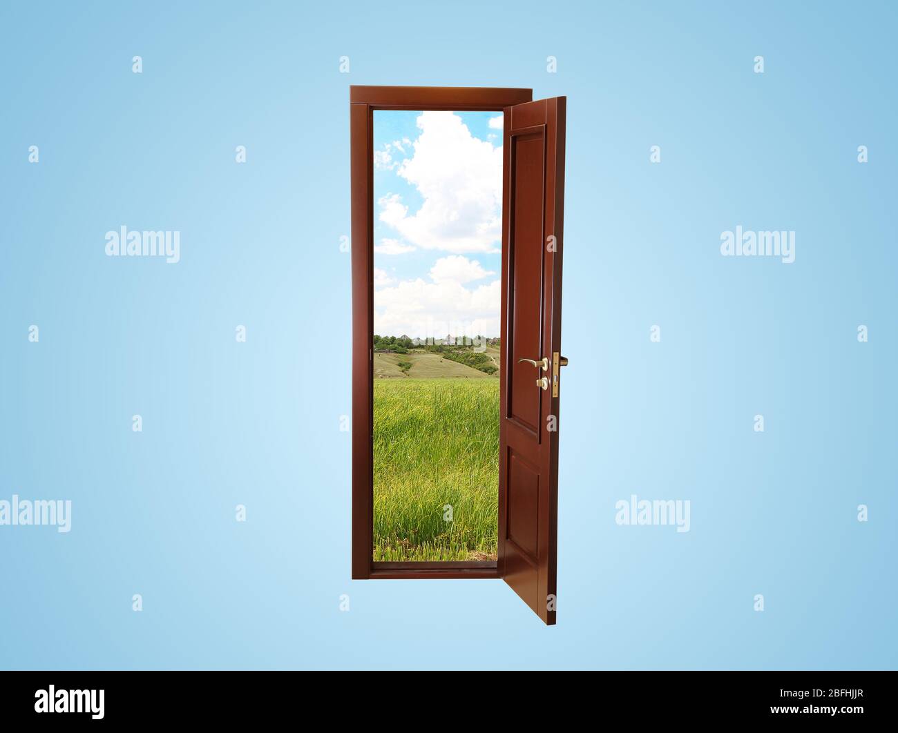Field view through an open door on blue background Stock Photo - Alamy