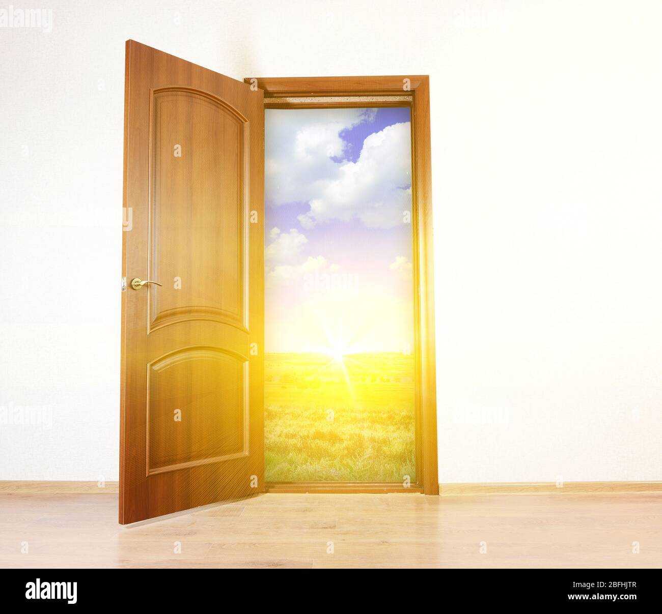 Open door to new life in room Stock Photo - Alamy