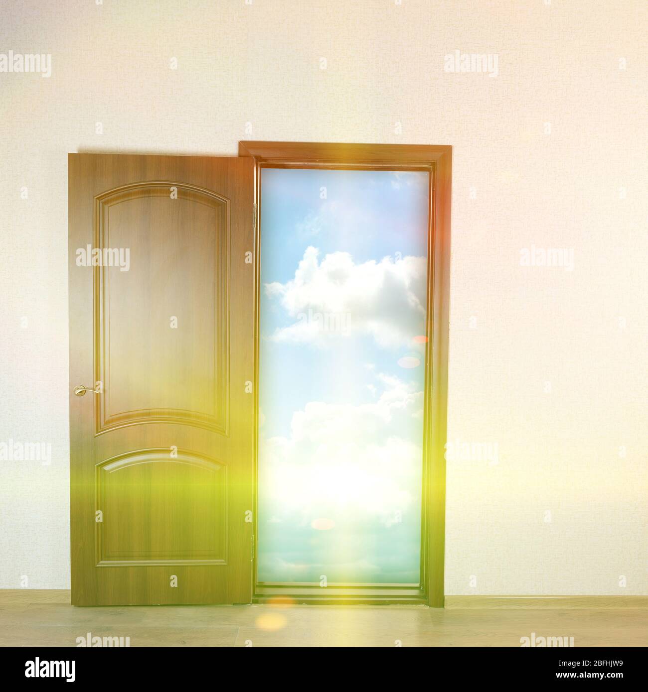 Open door to new life in room Stock Photo - Alamy