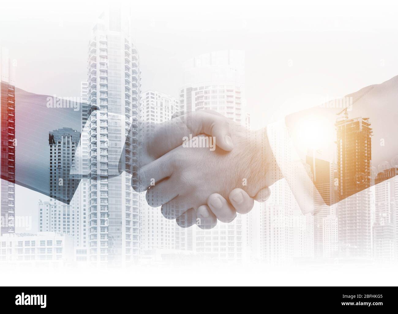 The concept of cooperation with handshake Stock Photo - Alamy