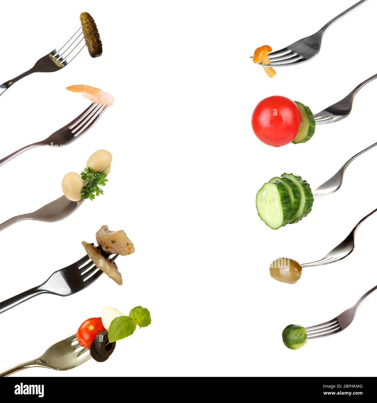 Collage of food on forks isolated on white Stock Photo - Alamy