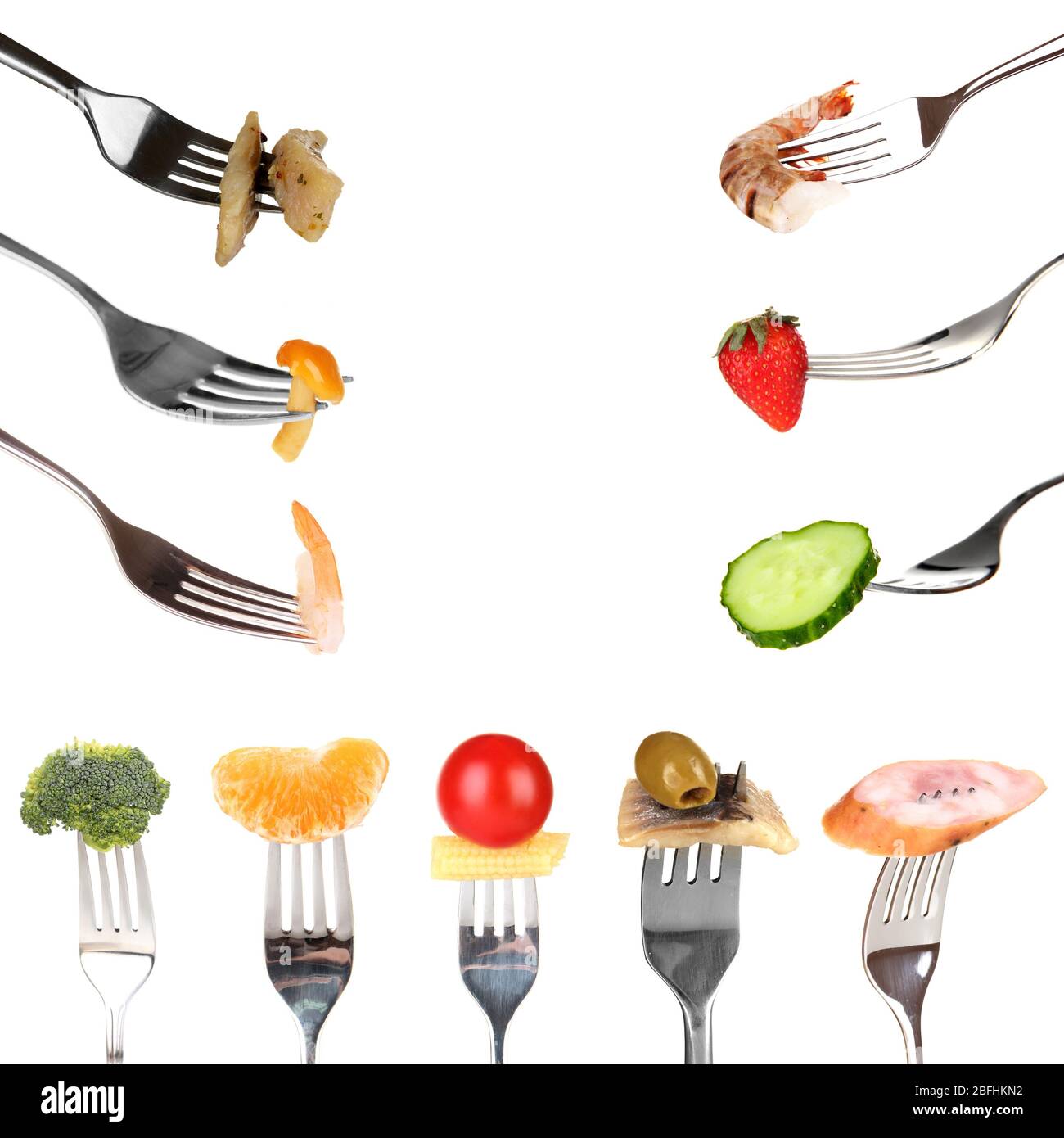 Collage of food on forks isolated on white Stock Photo - Alamy