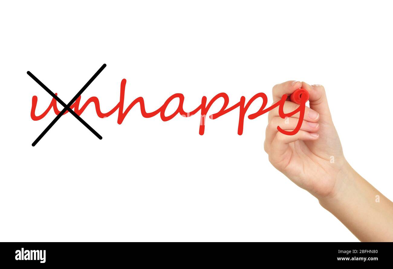 Human hand turning word unhappy into happy Stock Photo - Alamy