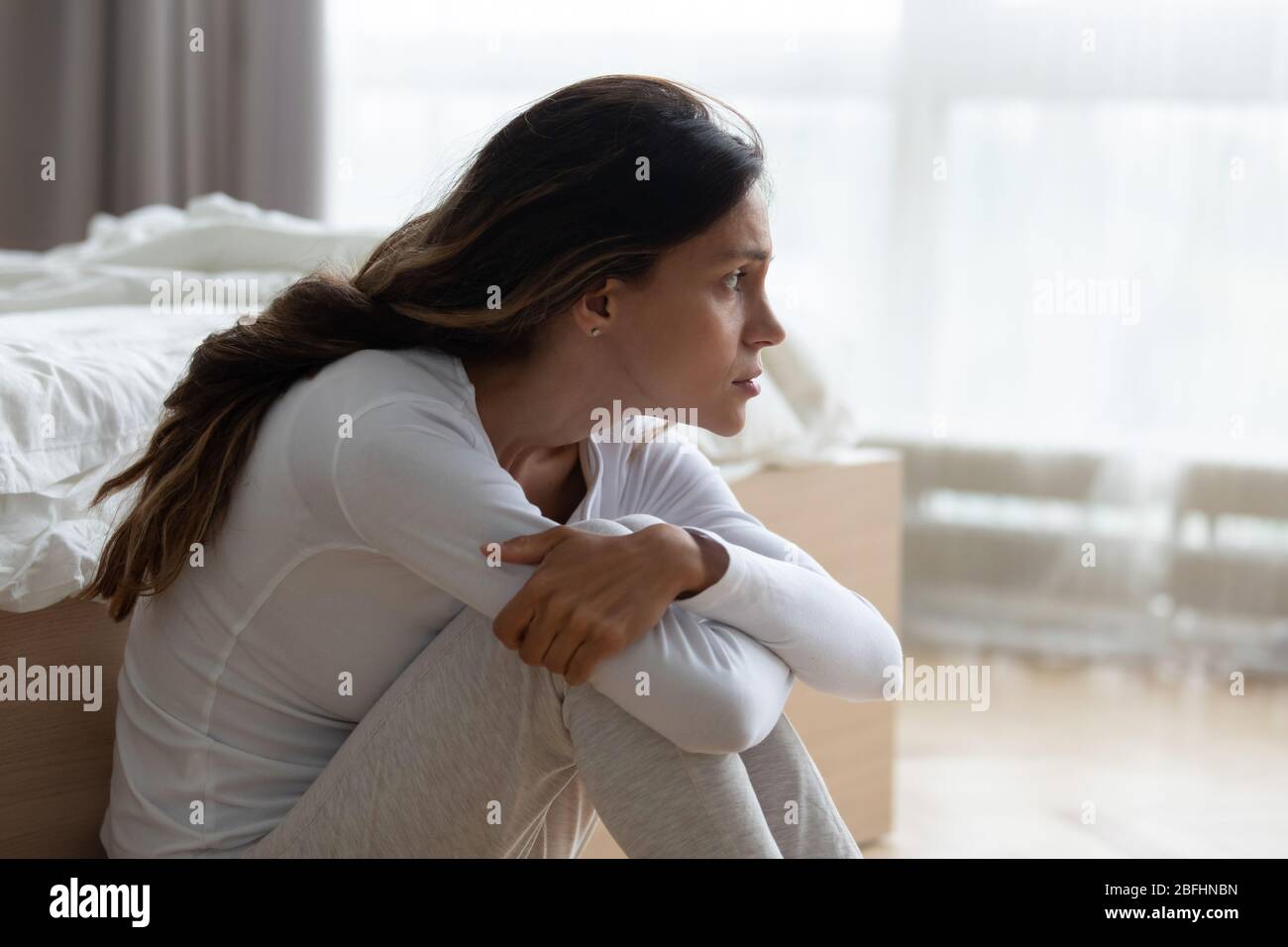 Embracing embrace knees legs hi-res stock photography and images - Alamy