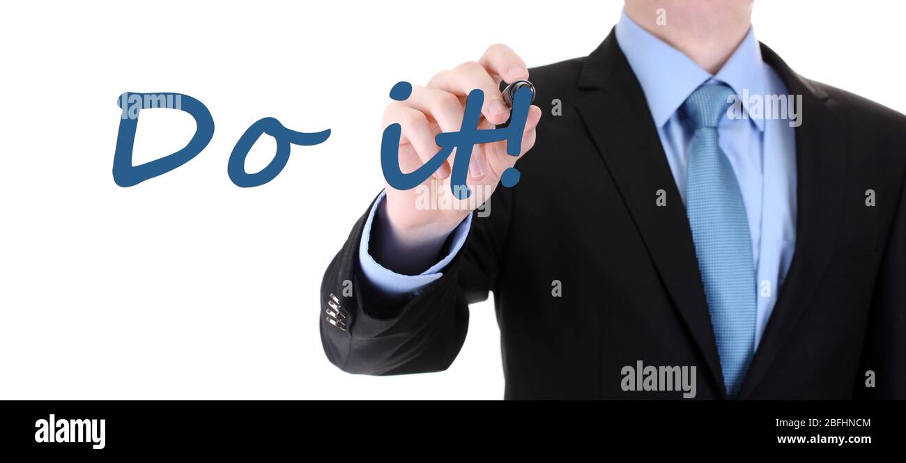 Businessman writing Do it on transparent board Stock Photo - Alamy