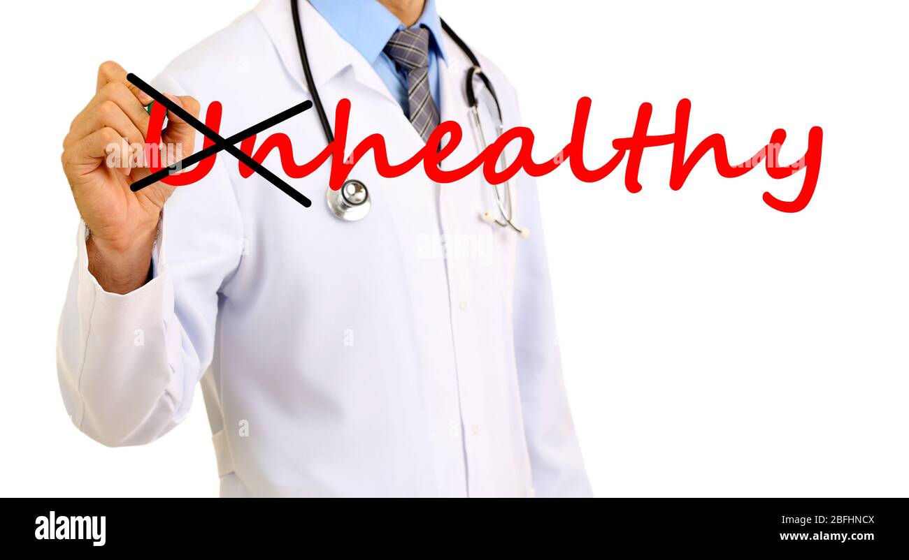 Doctor turning word unhealthy into healthy Stock Photo - Alamy