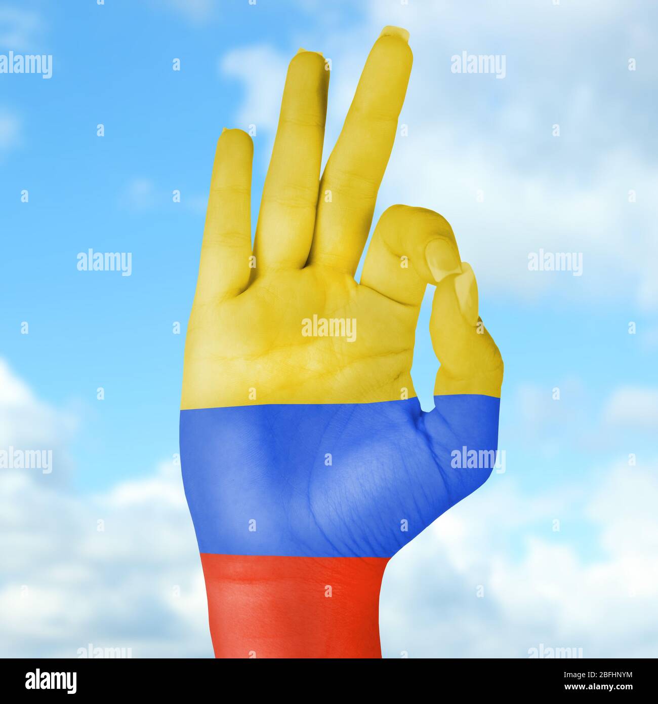 Flag of Colombia painted on hand Stock Photo - Alamy