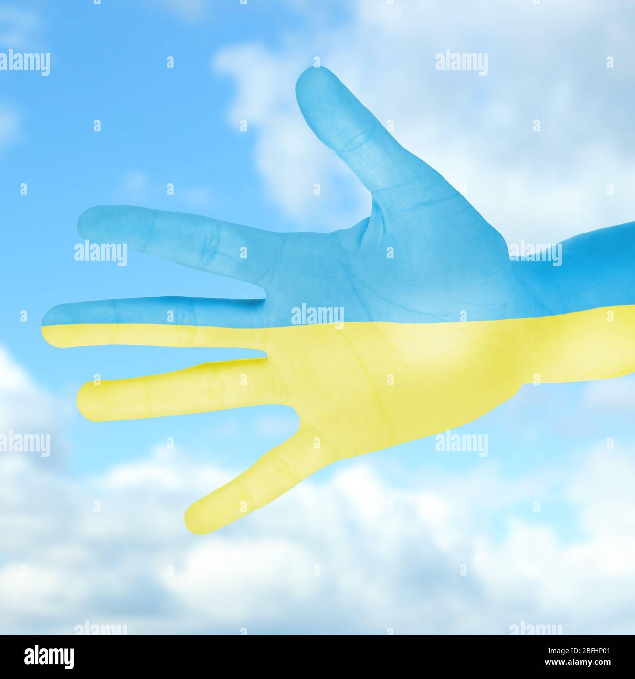 Flag of Ukraine painted on hand Stock Photo - Alamy