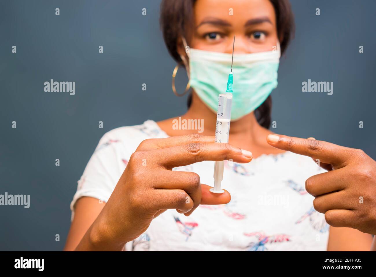 Doctor holding syringe and getting ready for injection,female doctor ...