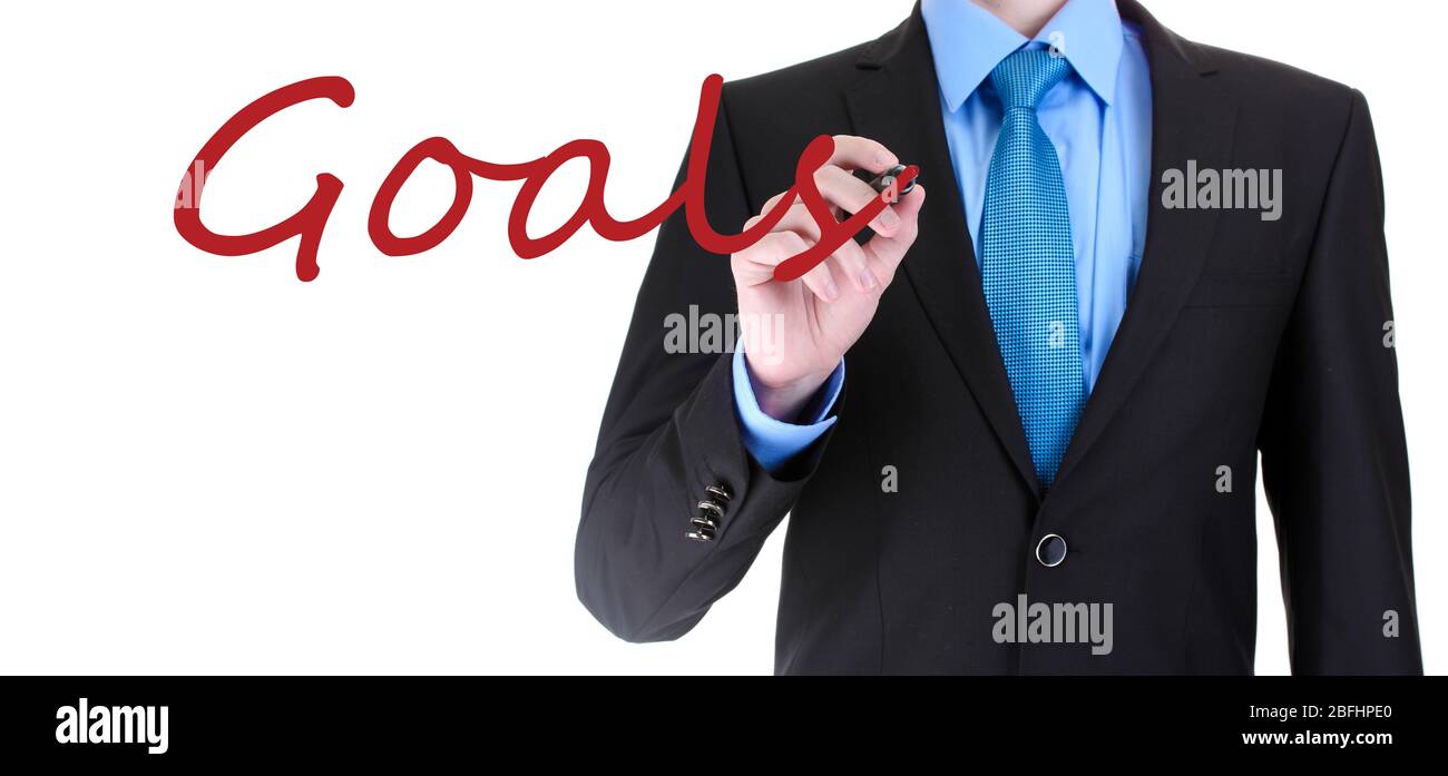 Businessman writing word Goals on transparent board Stock Photo - Alamy