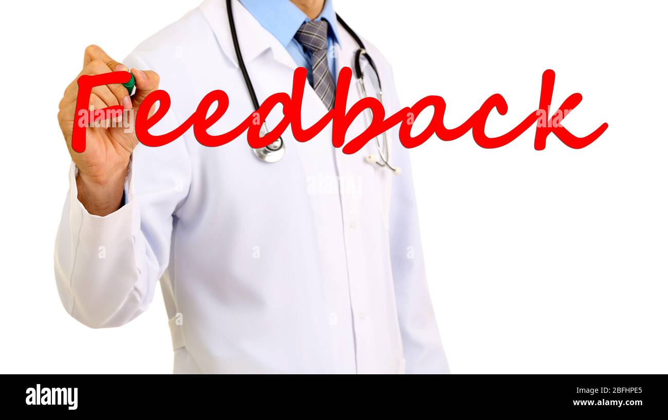 Doctor writing word Feedback on transparent board Stock Photo - Alamy