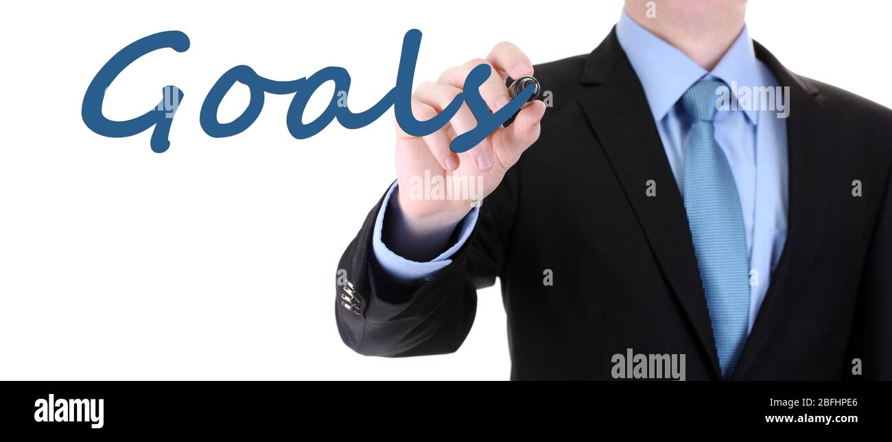 Businessman writing word Goals on transparent board Stock Photo - Alamy