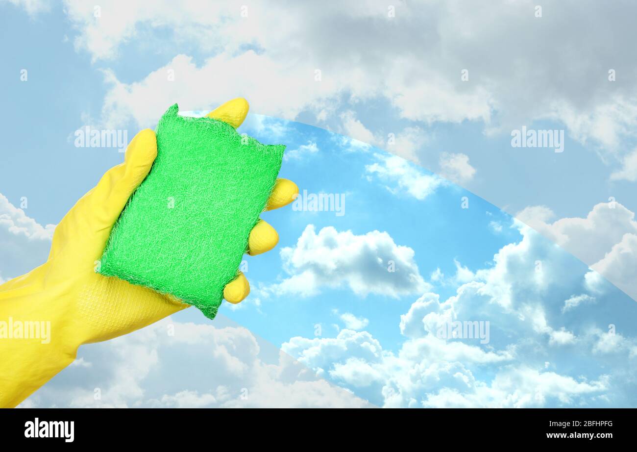 Hand with sponge cleaning dirty window Stock Photo - Alamy