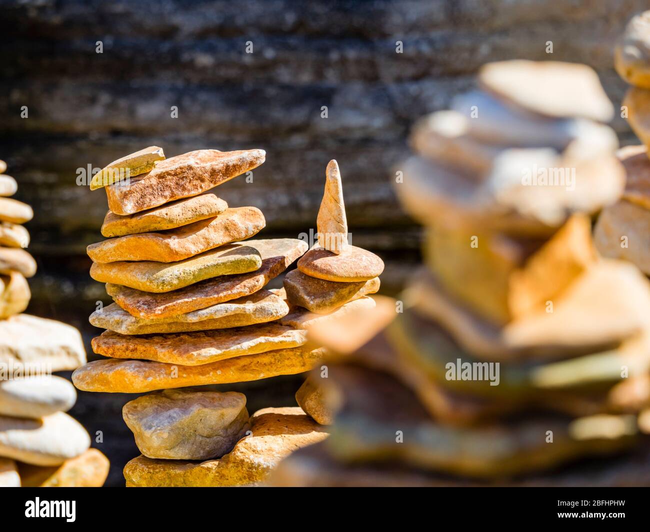 Piled stones on beach prominent sharp pointy to point stone rock ...