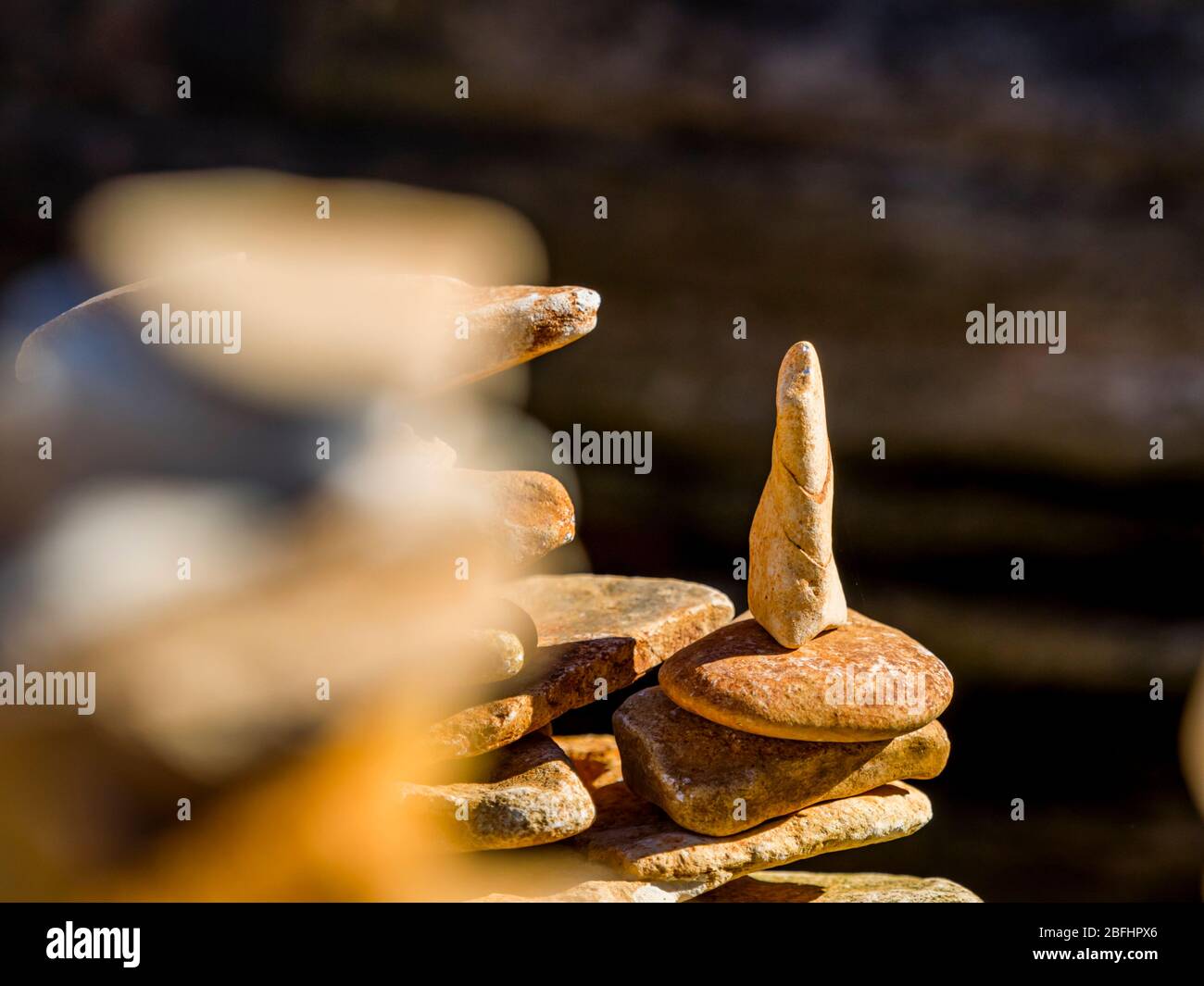 Piled stones on beach prominent sharp pointy to point stone rock ...