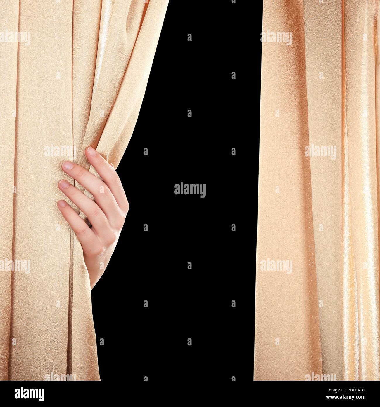 Hand opening curtain on black background Stock Photo - Alamy