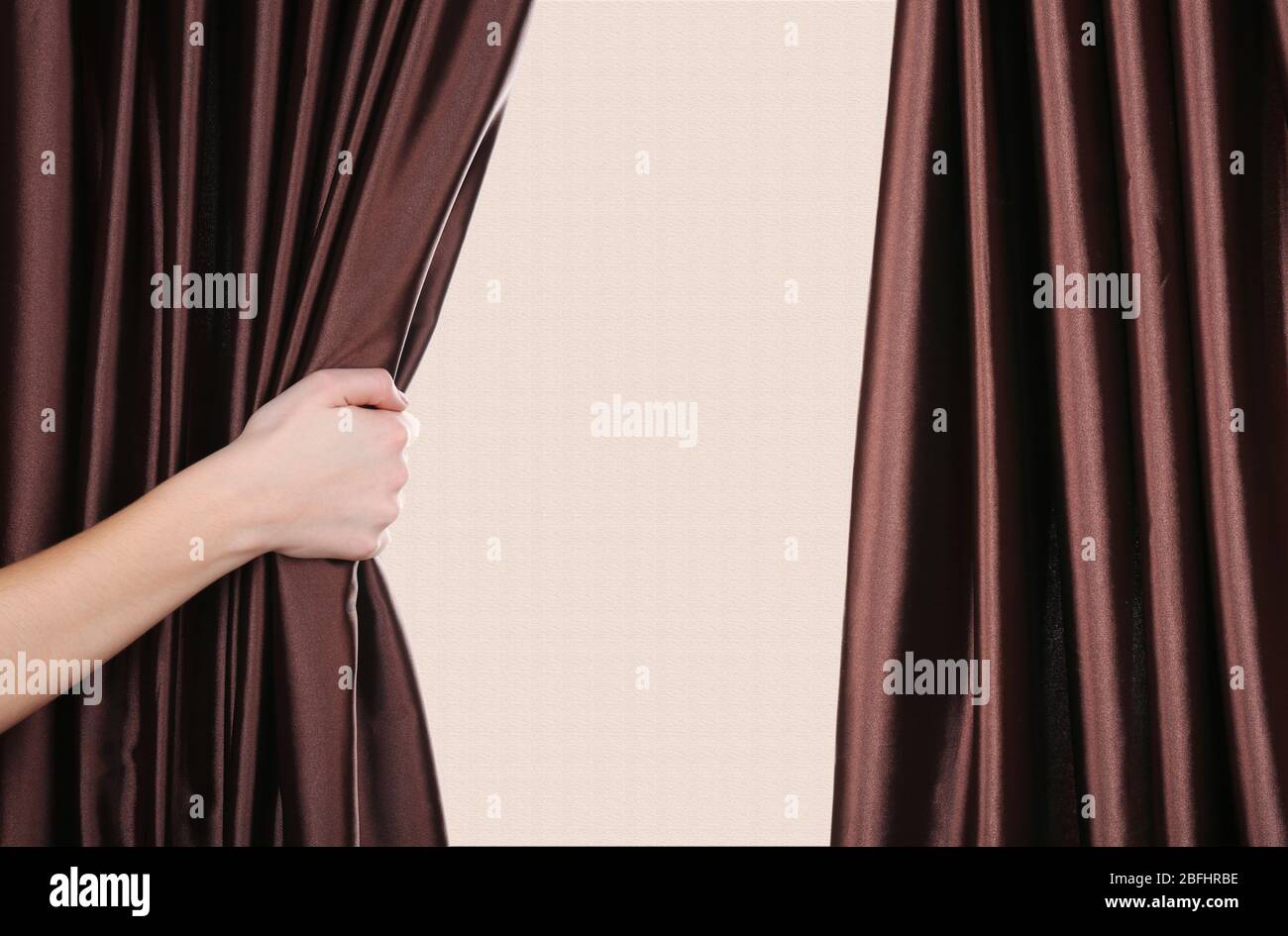 Hand opening red curtain on hi-res stock photography and images - Alamy