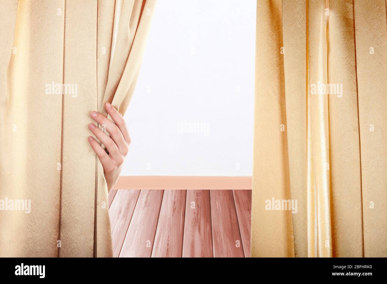 Hand opening curtain on room background Stock Photo - Alamy